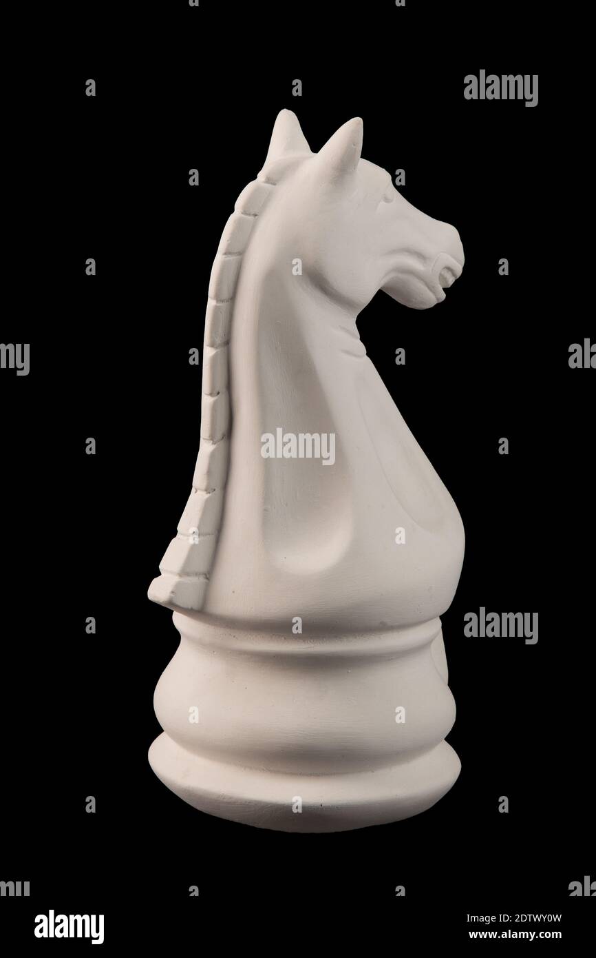 plaster figurine chess piece horse white background Stock Photo - Alamy