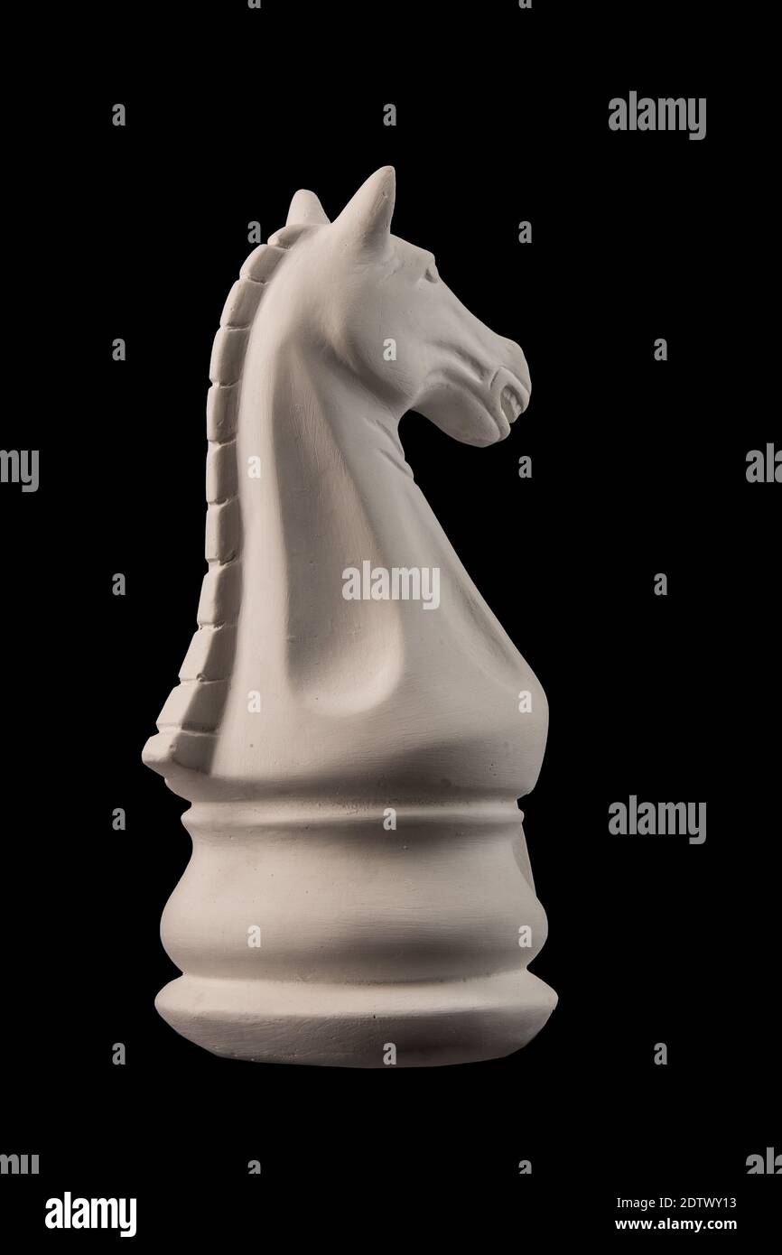 plaster figurine chess piece horse white background Stock Photo - Alamy