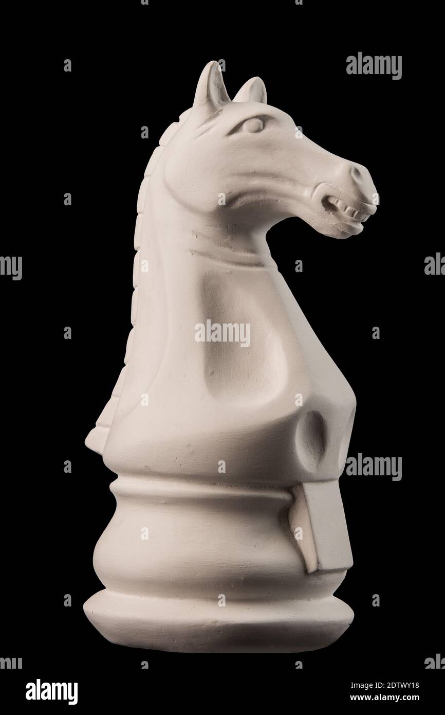 plaster figurine chess piece horse white background Stock Photo - Alamy