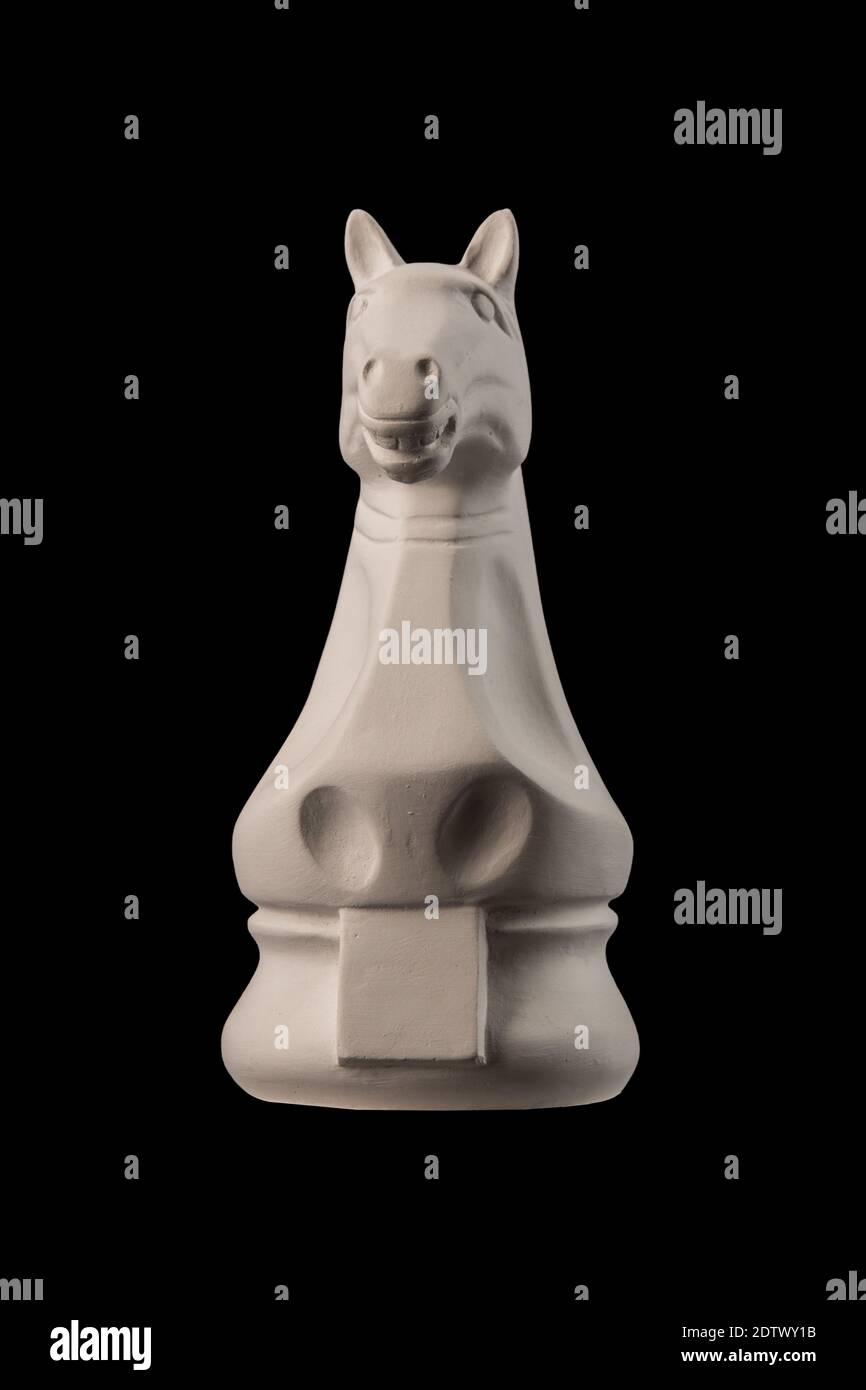 plaster figurine chess piece horse white background Stock Photo - Alamy