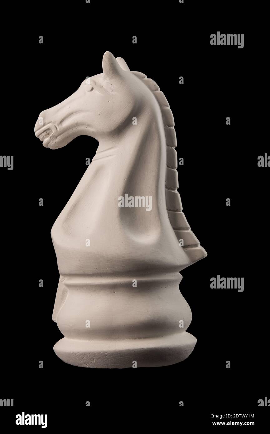plaster figurine chess piece horse white background Stock Photo - Alamy