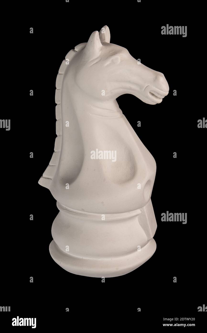 plaster figurine chess piece horse white background Stock Photo - Alamy