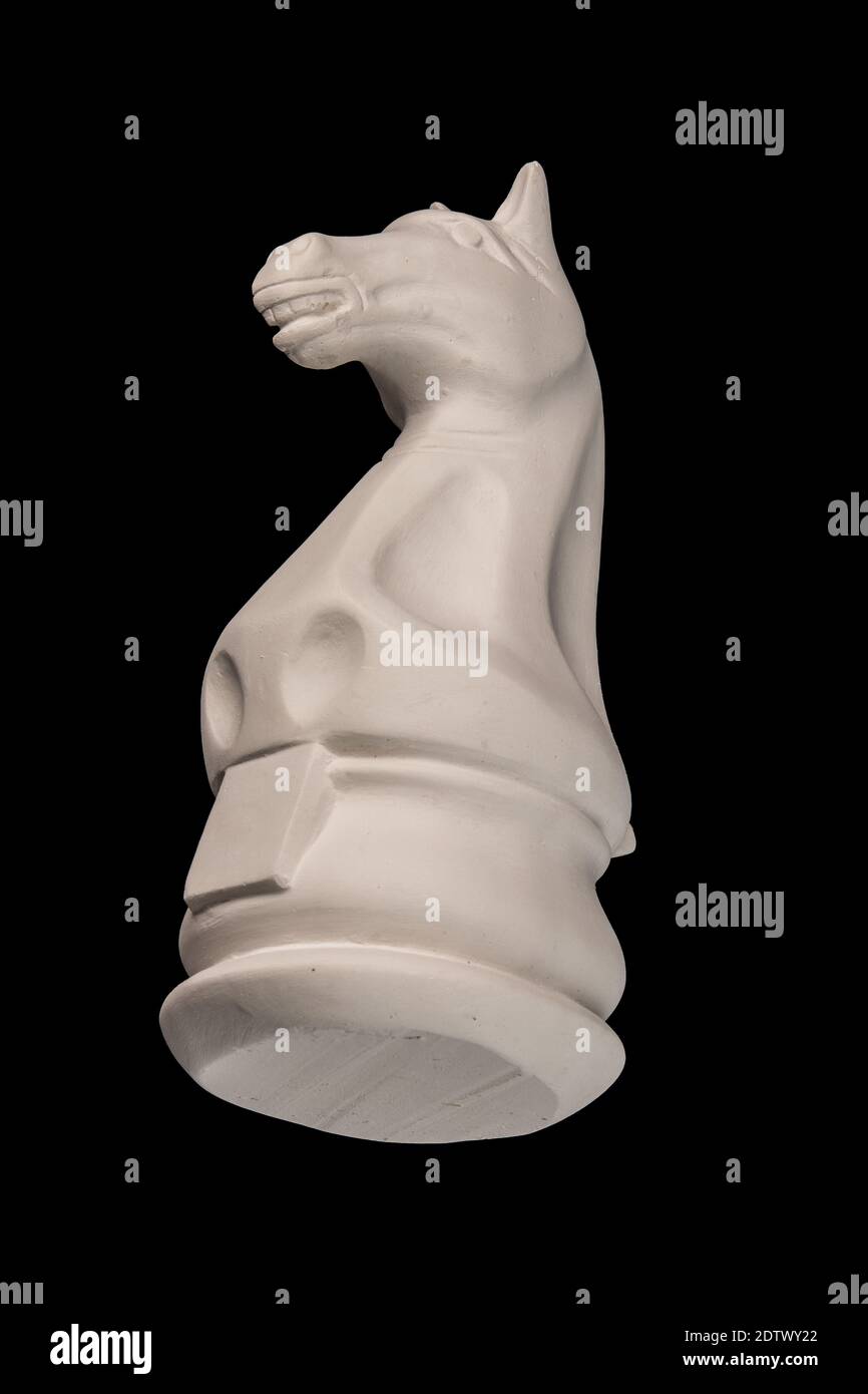plaster figurine chess piece horse white background Stock Photo - Alamy