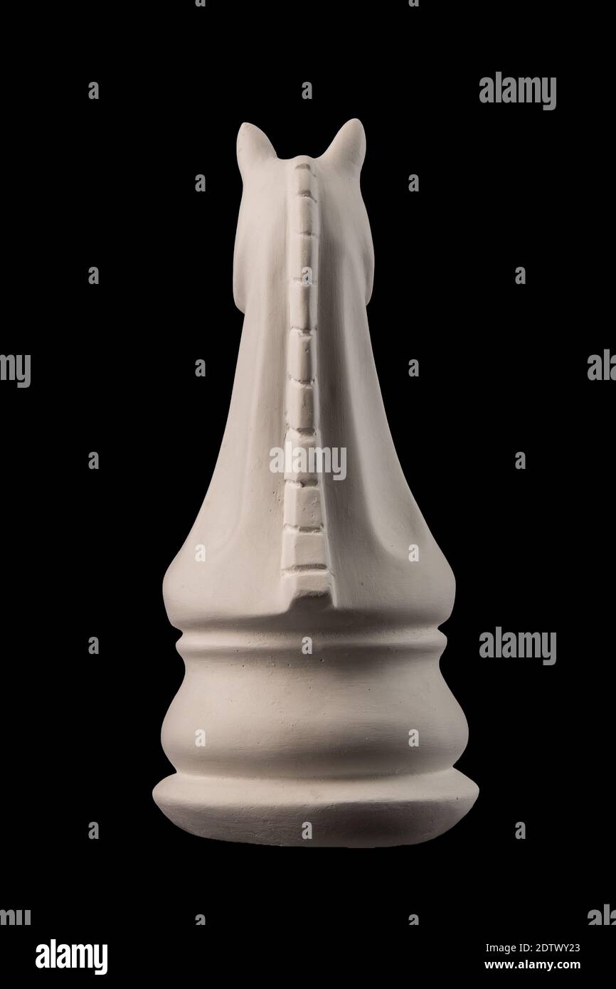 plaster figurine chess piece horse white background Stock Photo - Alamy