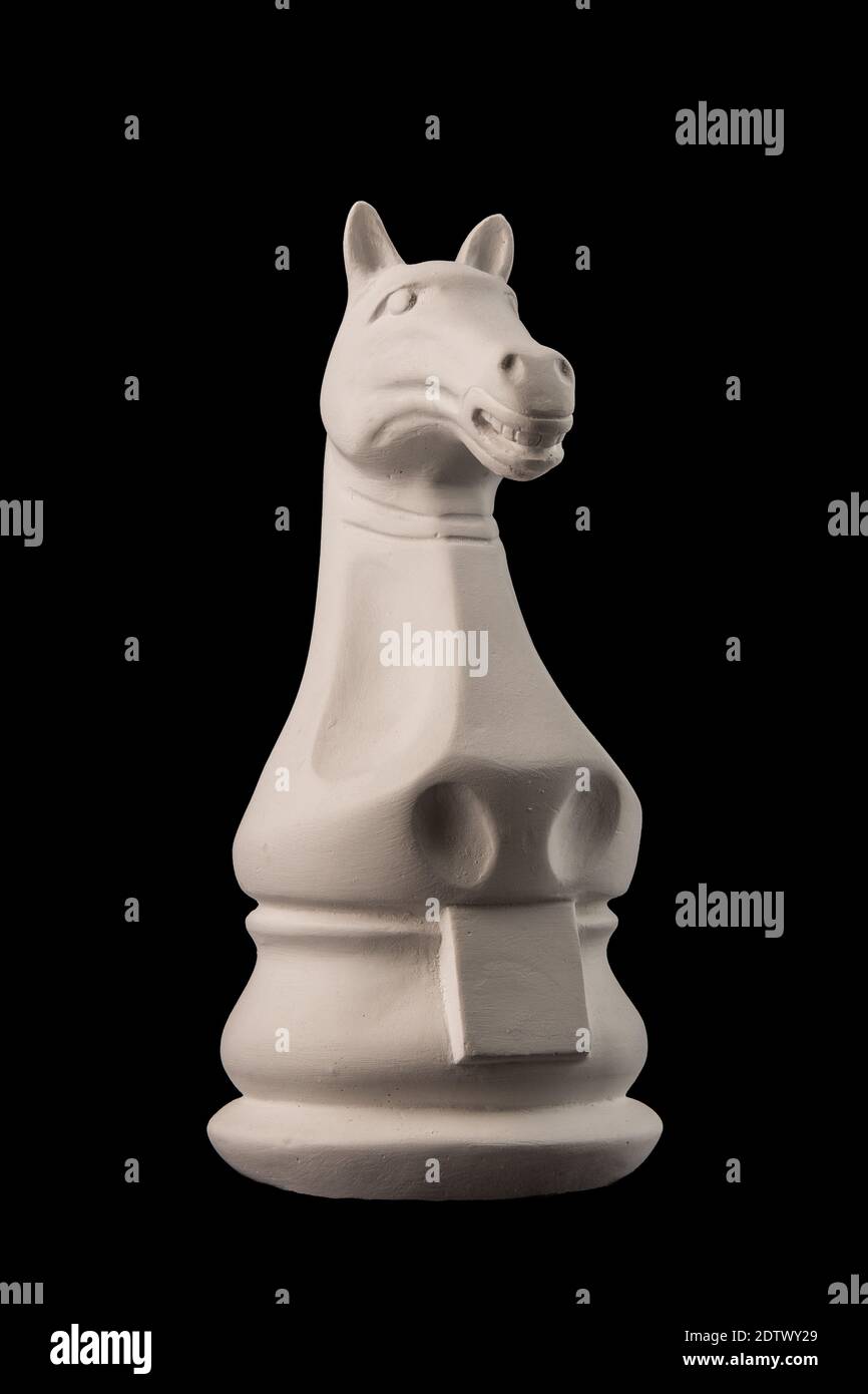 plaster figurine chess piece horse white background Stock Photo - Alamy