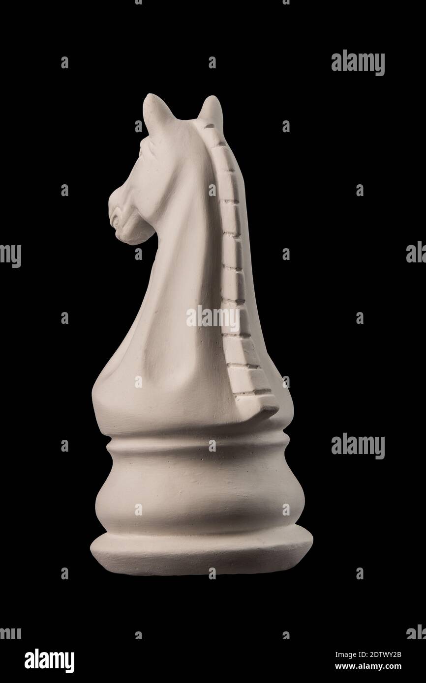 plaster figurine chess piece horse white background Stock Photo - Alamy
