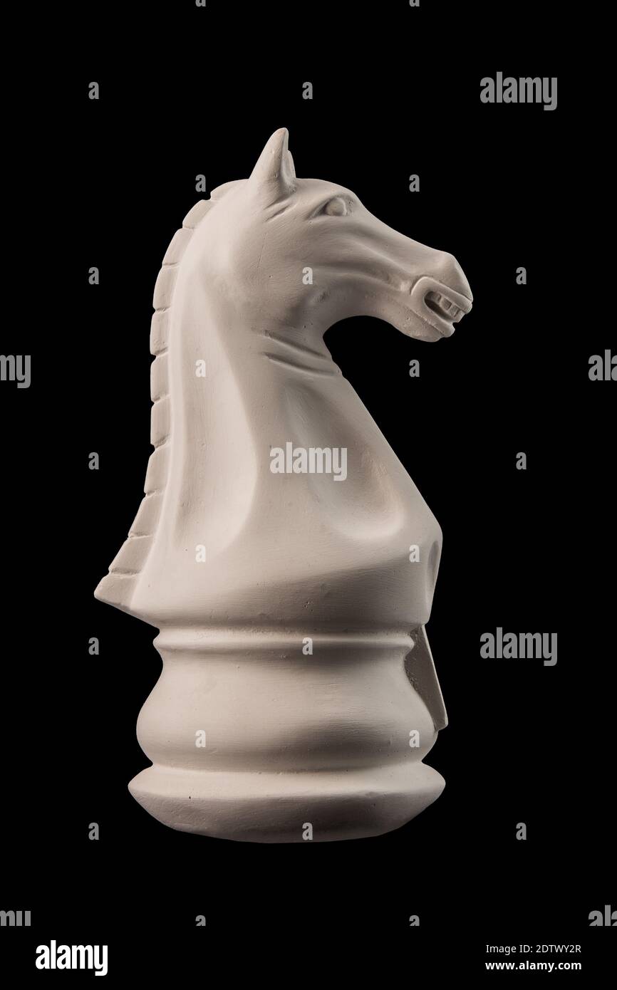 plaster figurine chess piece horse white background Stock Photo - Alamy
