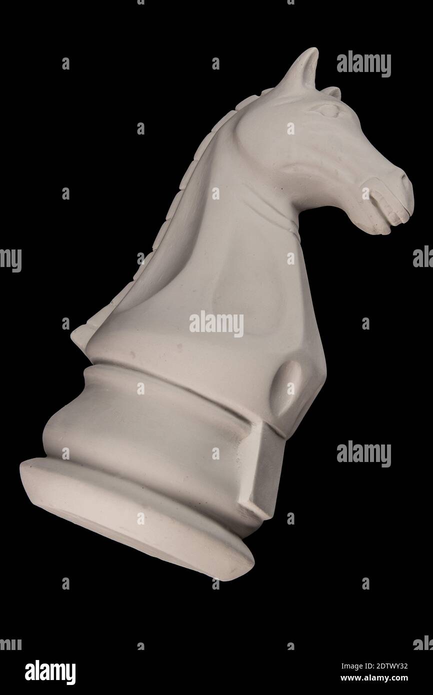 plaster figurine chess piece horse white background Stock Photo - Alamy