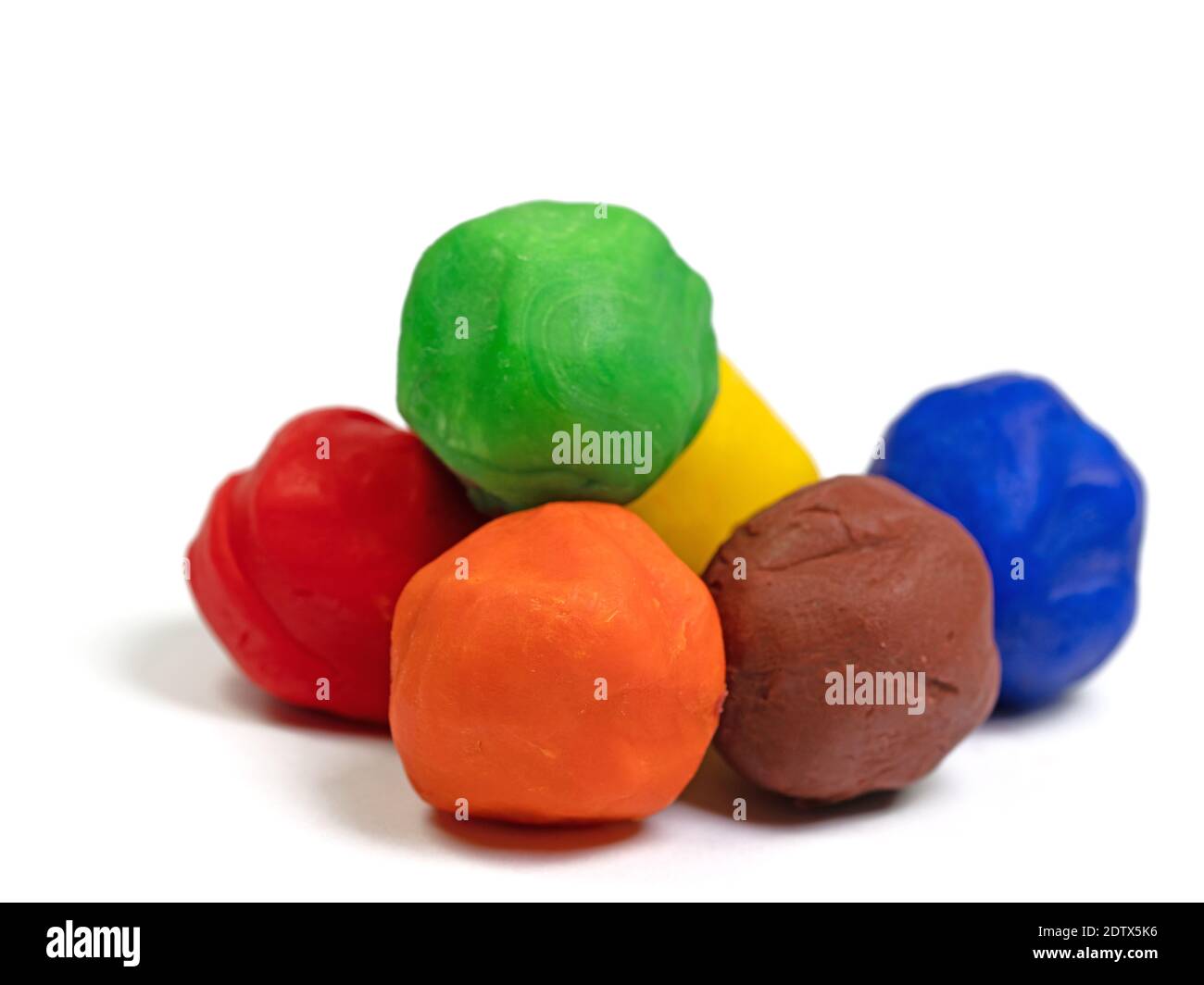 Colorful plasticine against a white background Stock Photo - Alamy