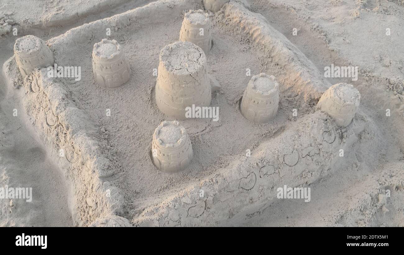 Children building a sand castle hi-res stock photography and images - Alamy