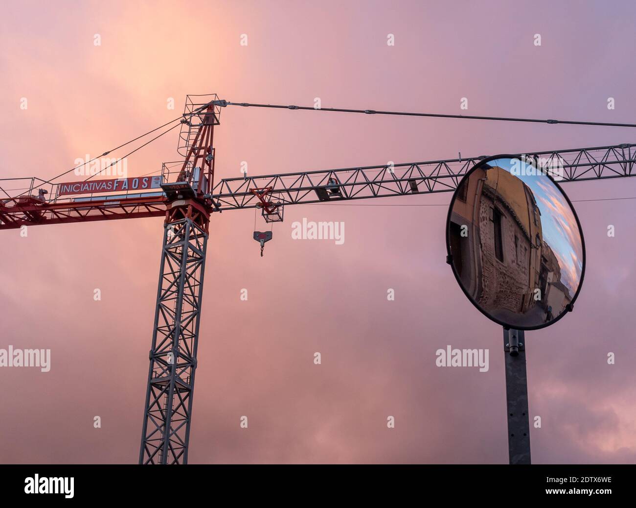 CONSTRUCTION CRANE WITH MIRROR FOR THE CARS, WITH A NICE OVERCAST SKY ...