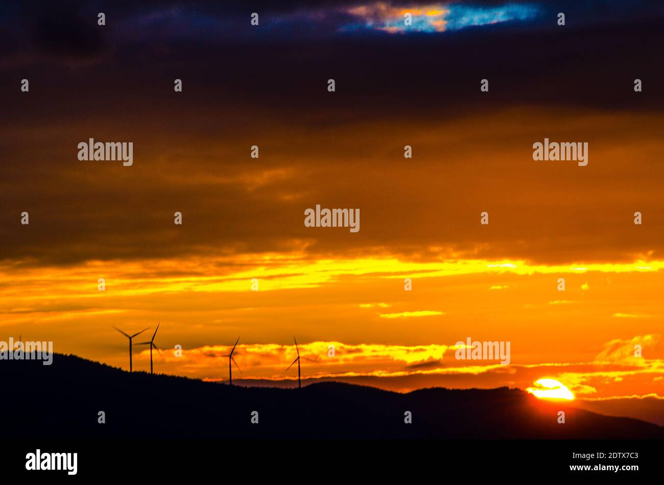 sunset with wind turbines Stock Photo - Alamy
