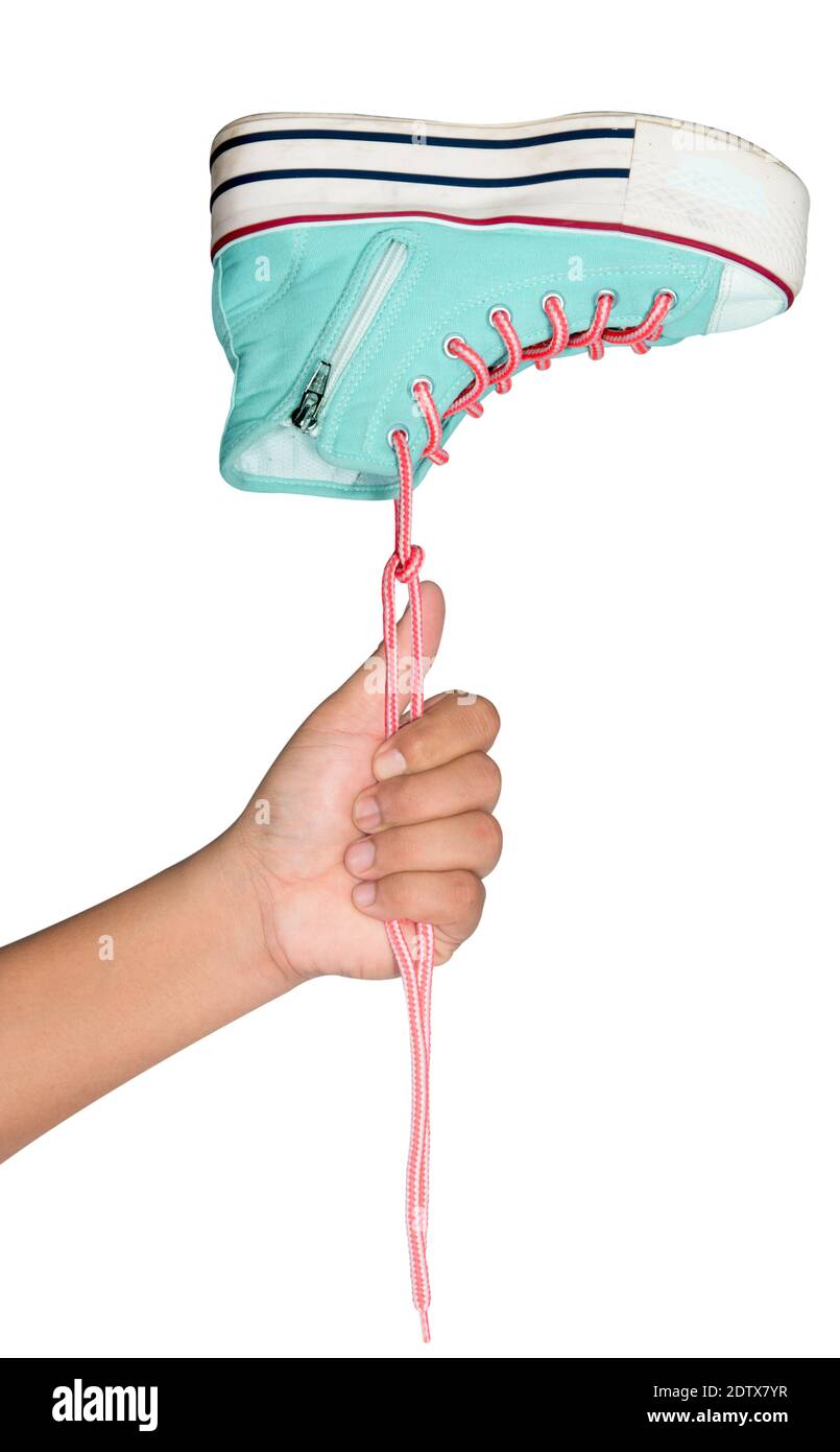Hand holding shoe cut out hi-res stock photography and images - Alamy