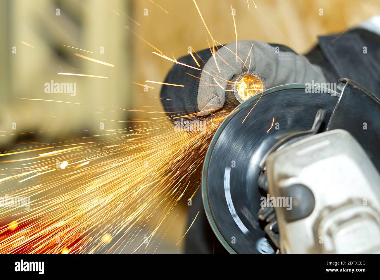 worker makes metal steel pipe grinding, close-up many sparks Stock ...