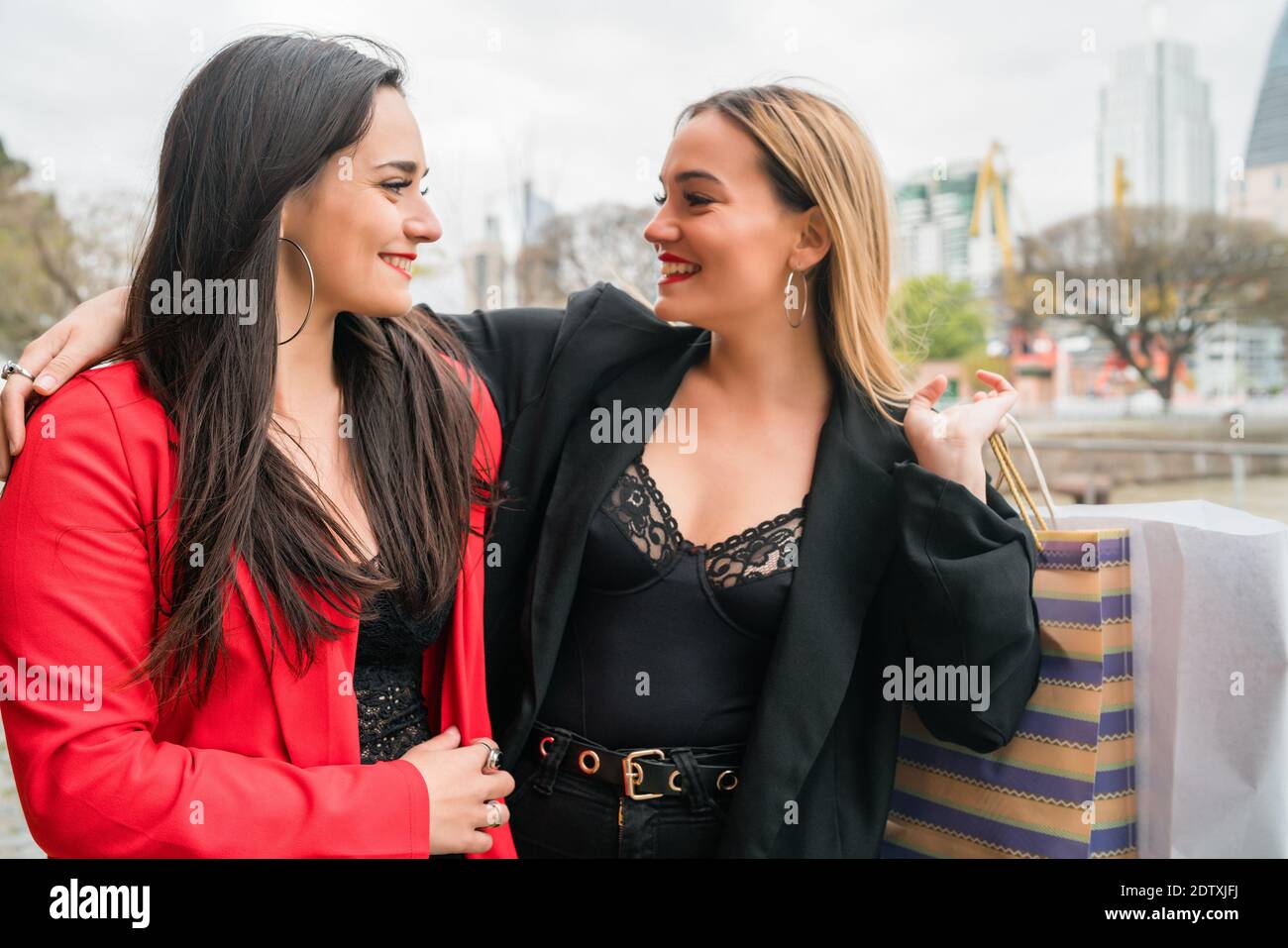 Two young friends shopping together Stock Photo - Alamy