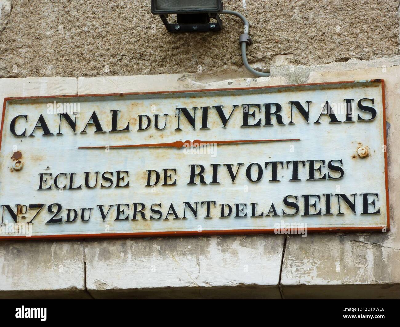signs at houses at sluice alongside Canal du Nivernais in Bourgogne ...