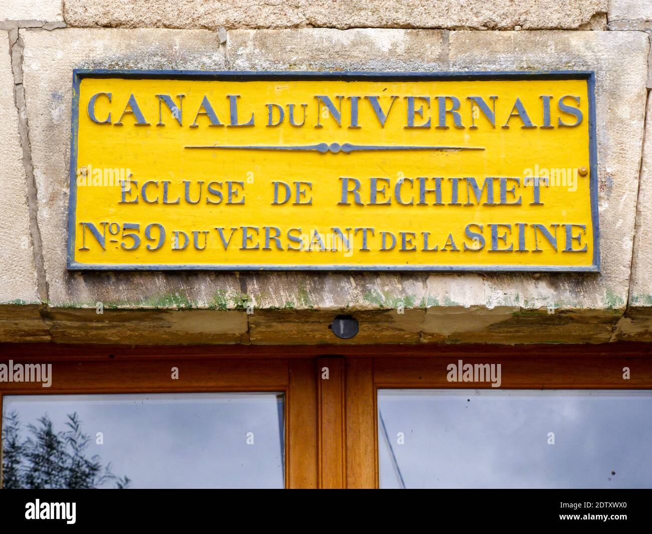 signs at houses at sluice alongside Canal du Nivernais in Bourgogne ...