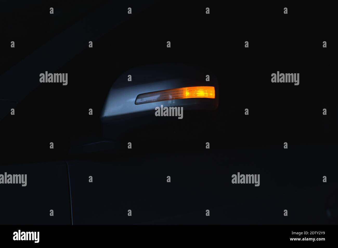 Illuminated Indicator On Side-view Mirror Of Car At Night Stock Photo ...