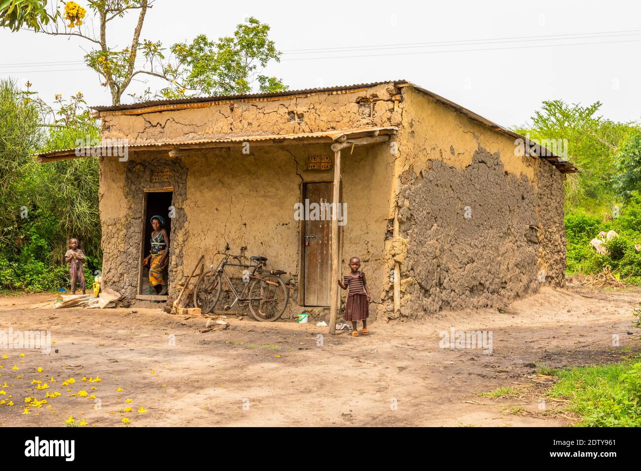 Uganda - March 05 2020: Poor children and their mother in front of ...