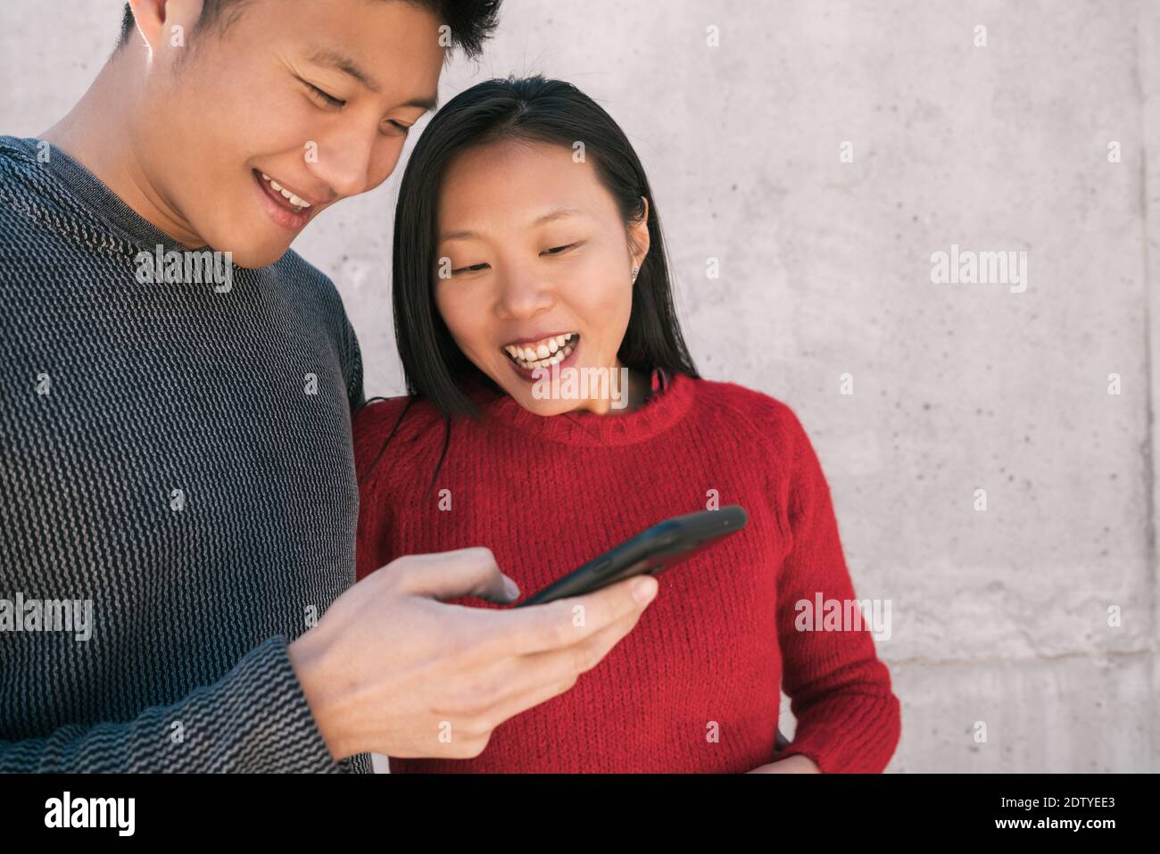 Young asian couple showing digital hi-res stock photography and images - Alamy