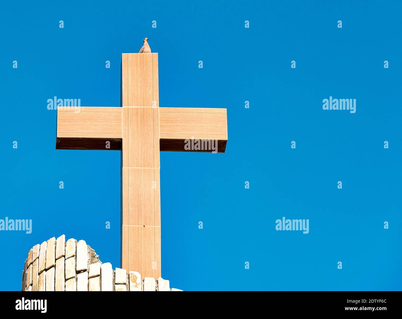 Peace concept: Wooden Christian cross with wild dove on top of church ...