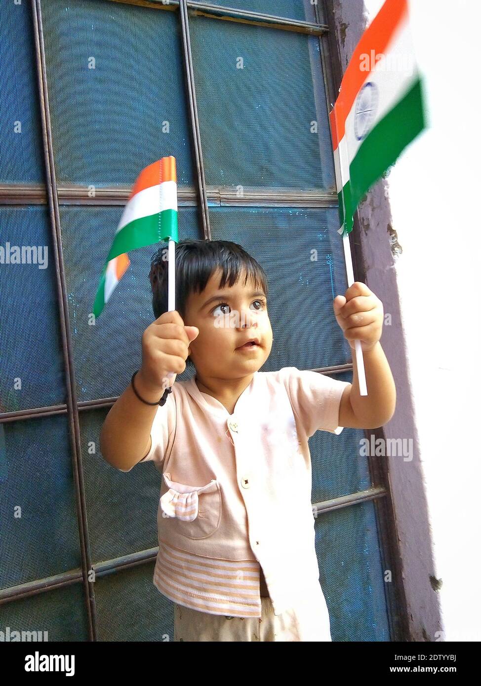 Holding indian national flags hi-res stock photography and images - Alamy