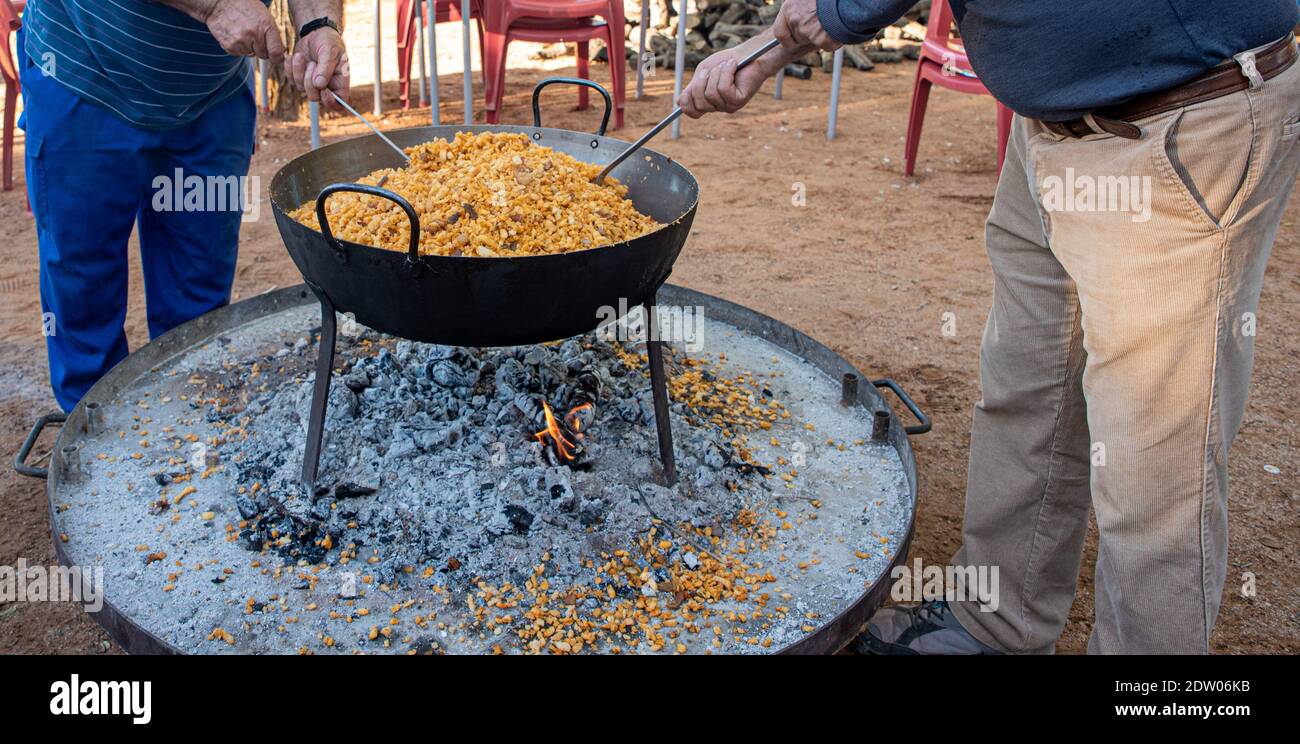 Cooking paella on the barbecue Stock Photo - Alamy