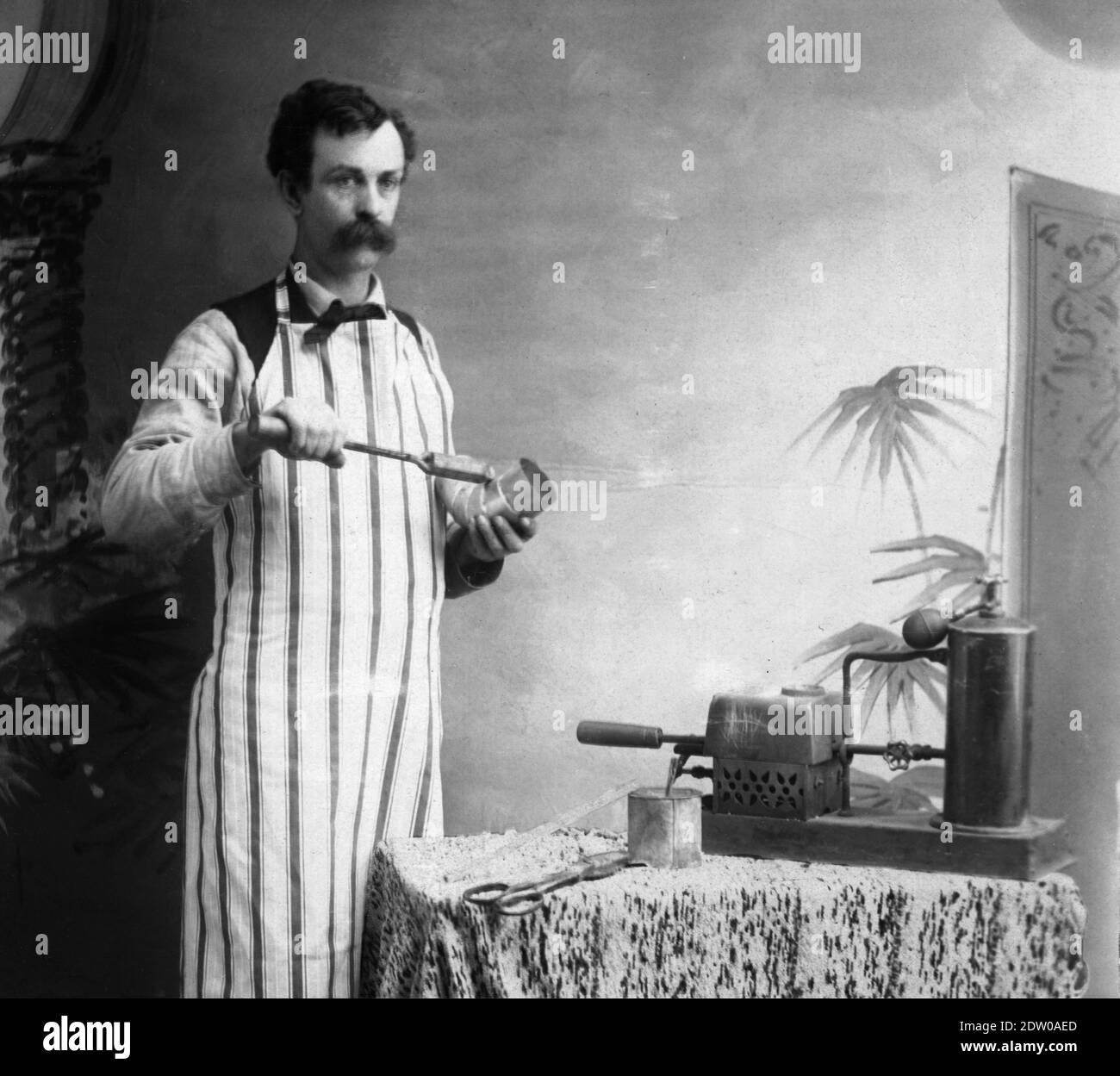 This man is a tinsmith, in about 1889. He posed here with his primary ...
