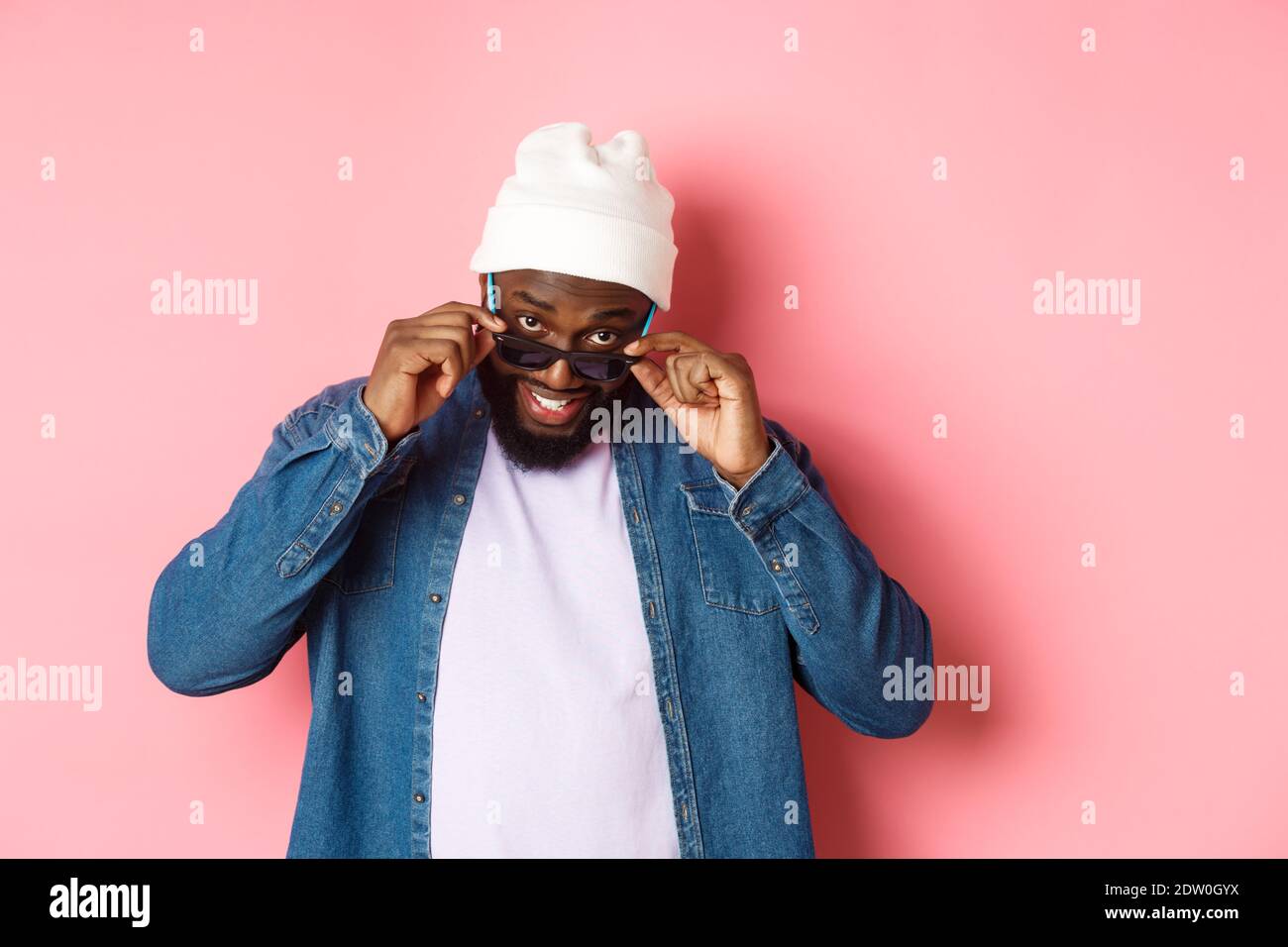 Confused african-american guy stare at camera, take-off sunglasses an ...