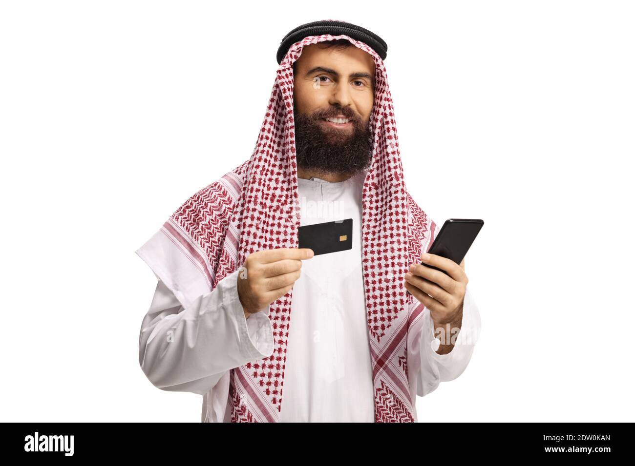 Saudi arab man using a credit card and a mobile phone for online ...