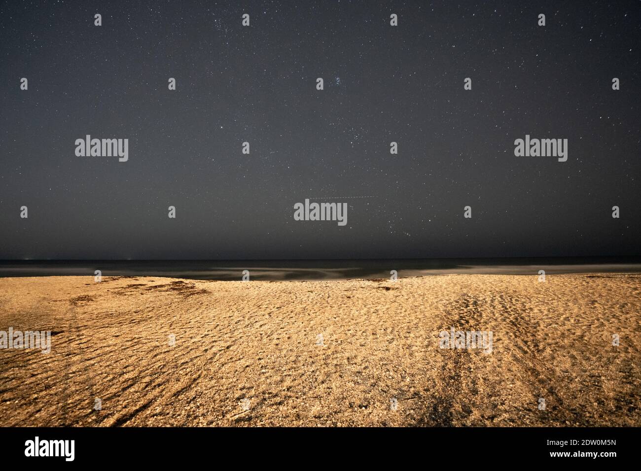 Night stars over the beach sand Stock Photo - Alamy
