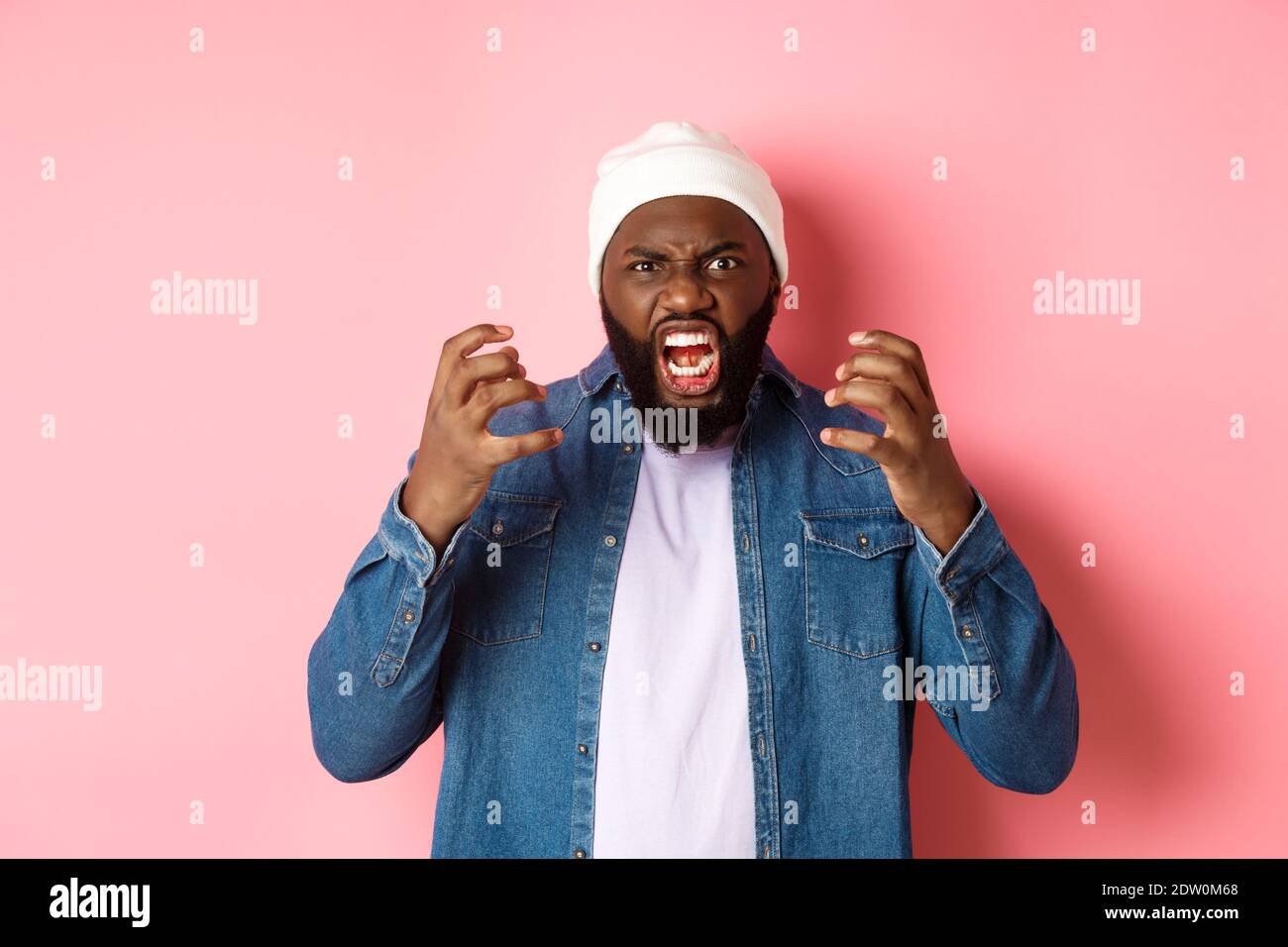 Angry african-american guy shouting and looking pissed-off, scream at ...