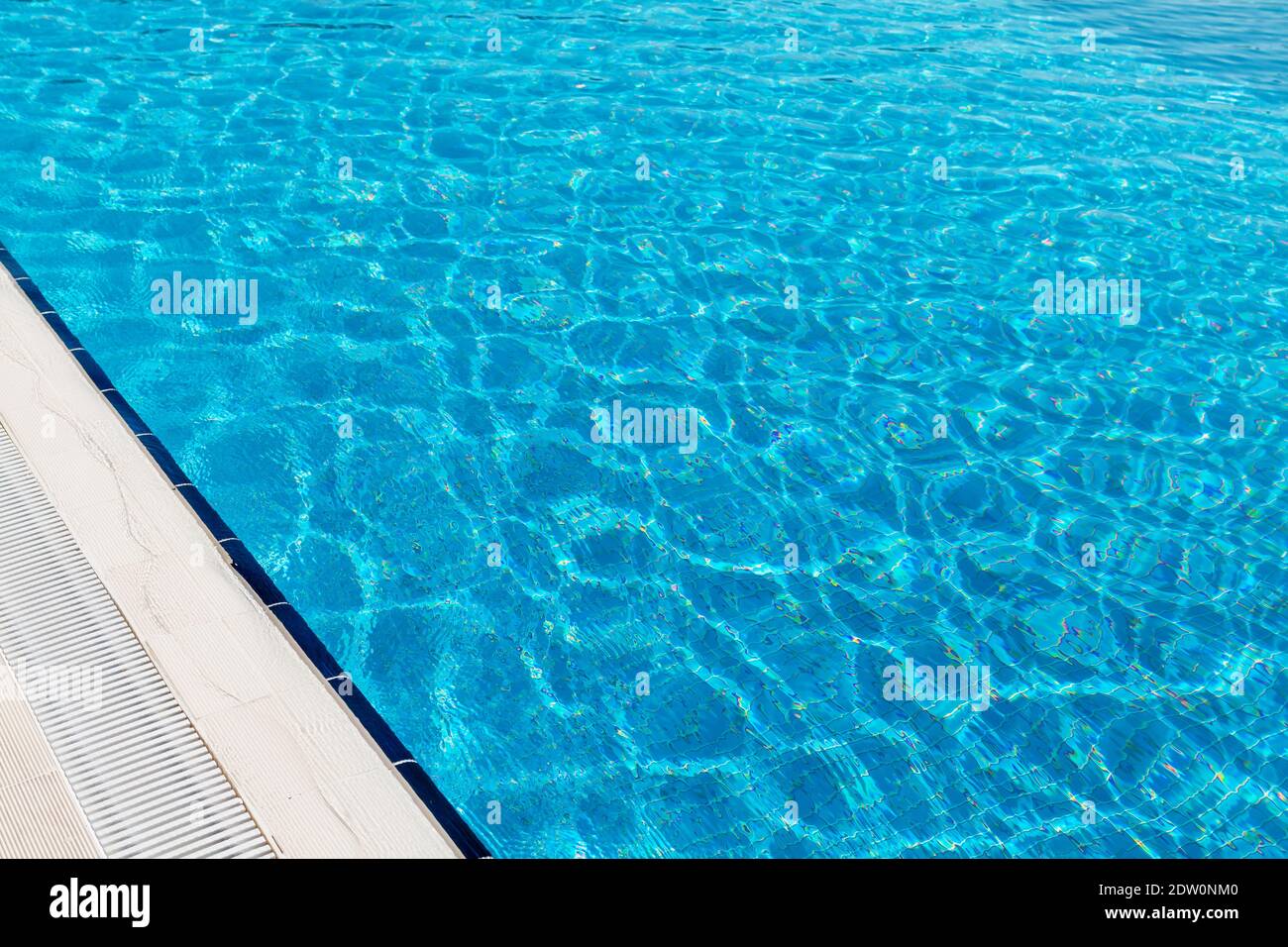 Sunny swimming pool in tropical resort. Summer vacation concept with ...