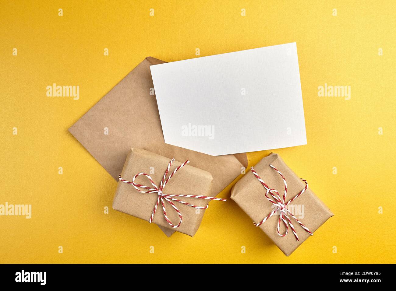 Greeting card mockup, white blank wish card with craft paper envelope ...