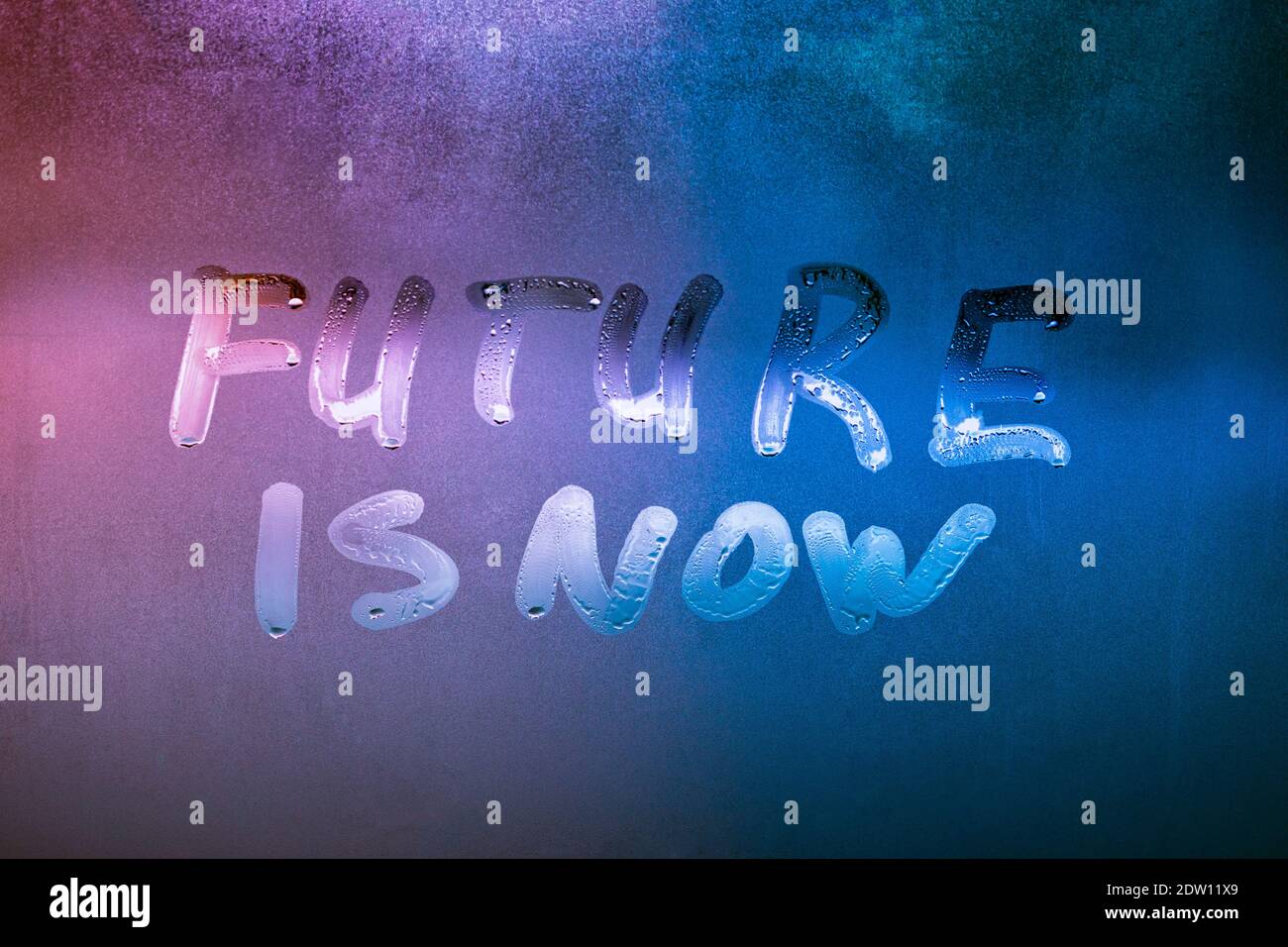 words future is now handwritten on night wet window glass surface Stock ...