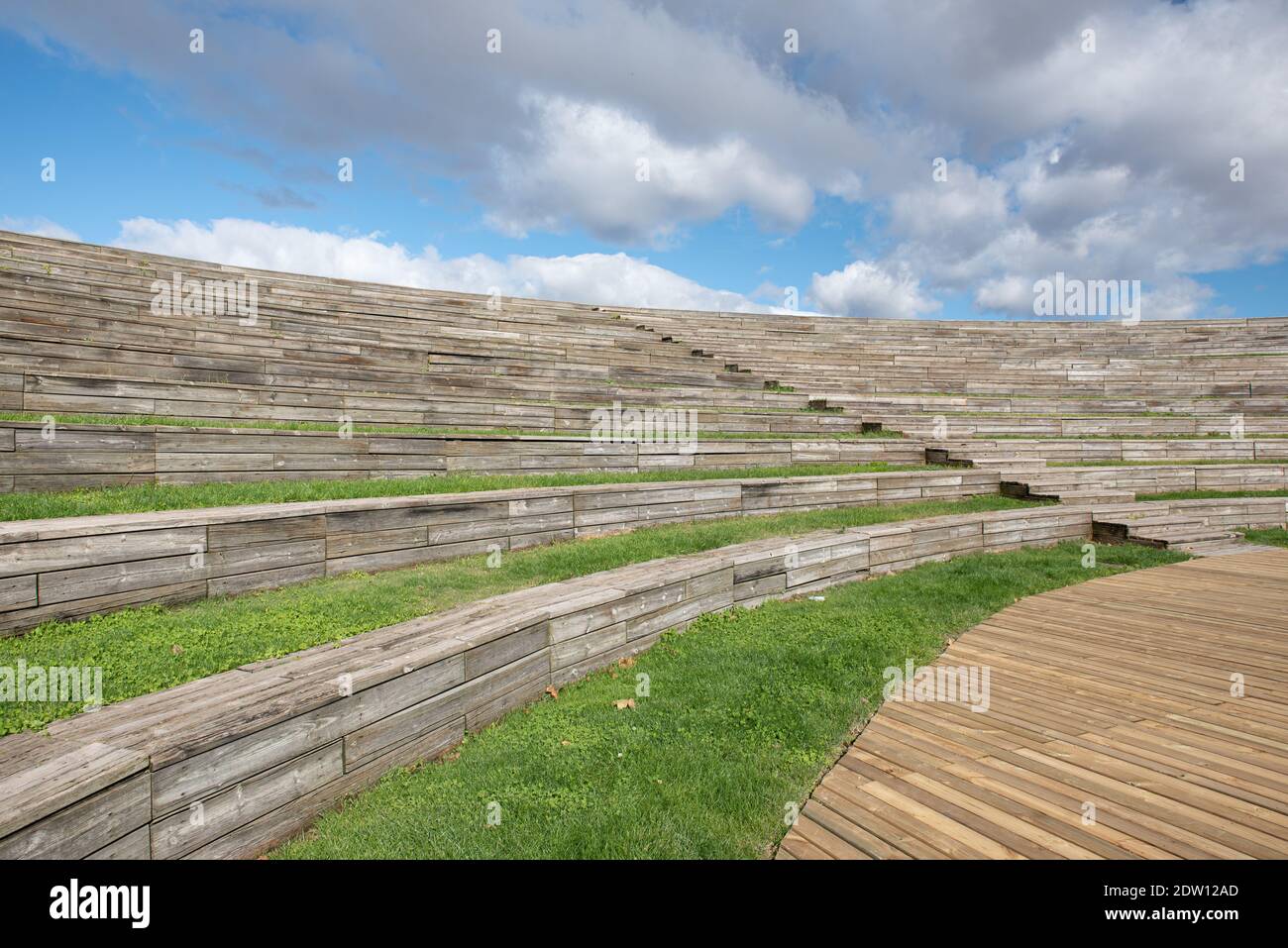 Wooden bleachers with public park space Stock Photo - Alamy