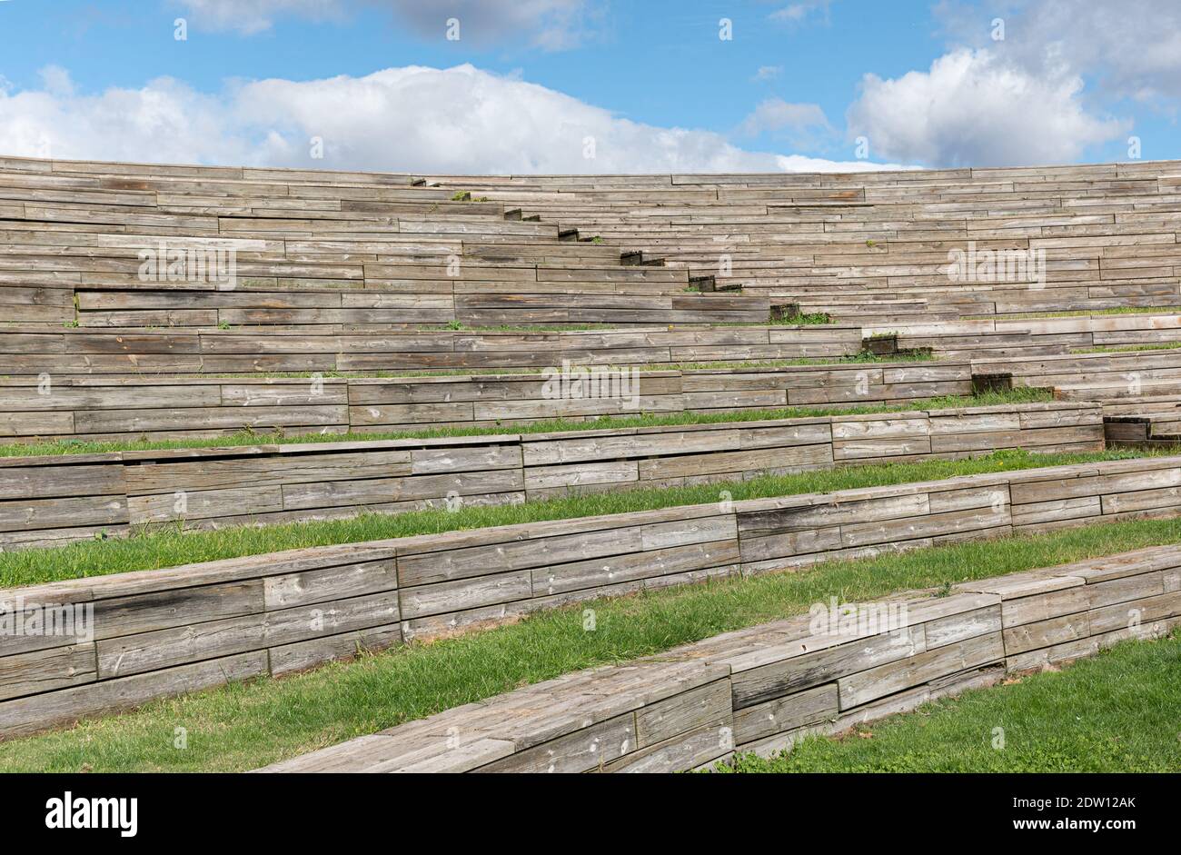 Wooden bleachers with public park space Stock Photo - Alamy