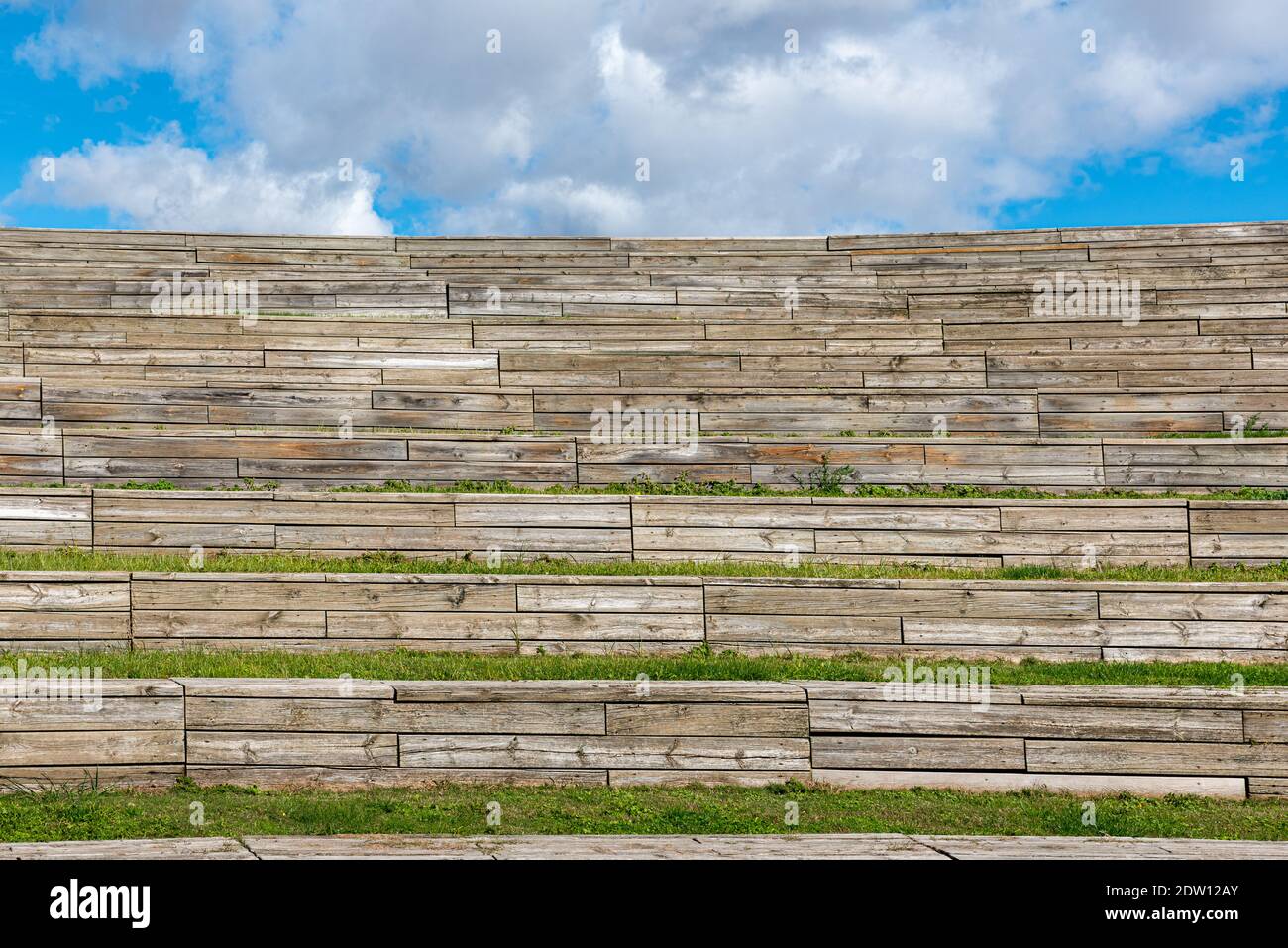 Wooden bleachers with public park space Stock Photo - Alamy