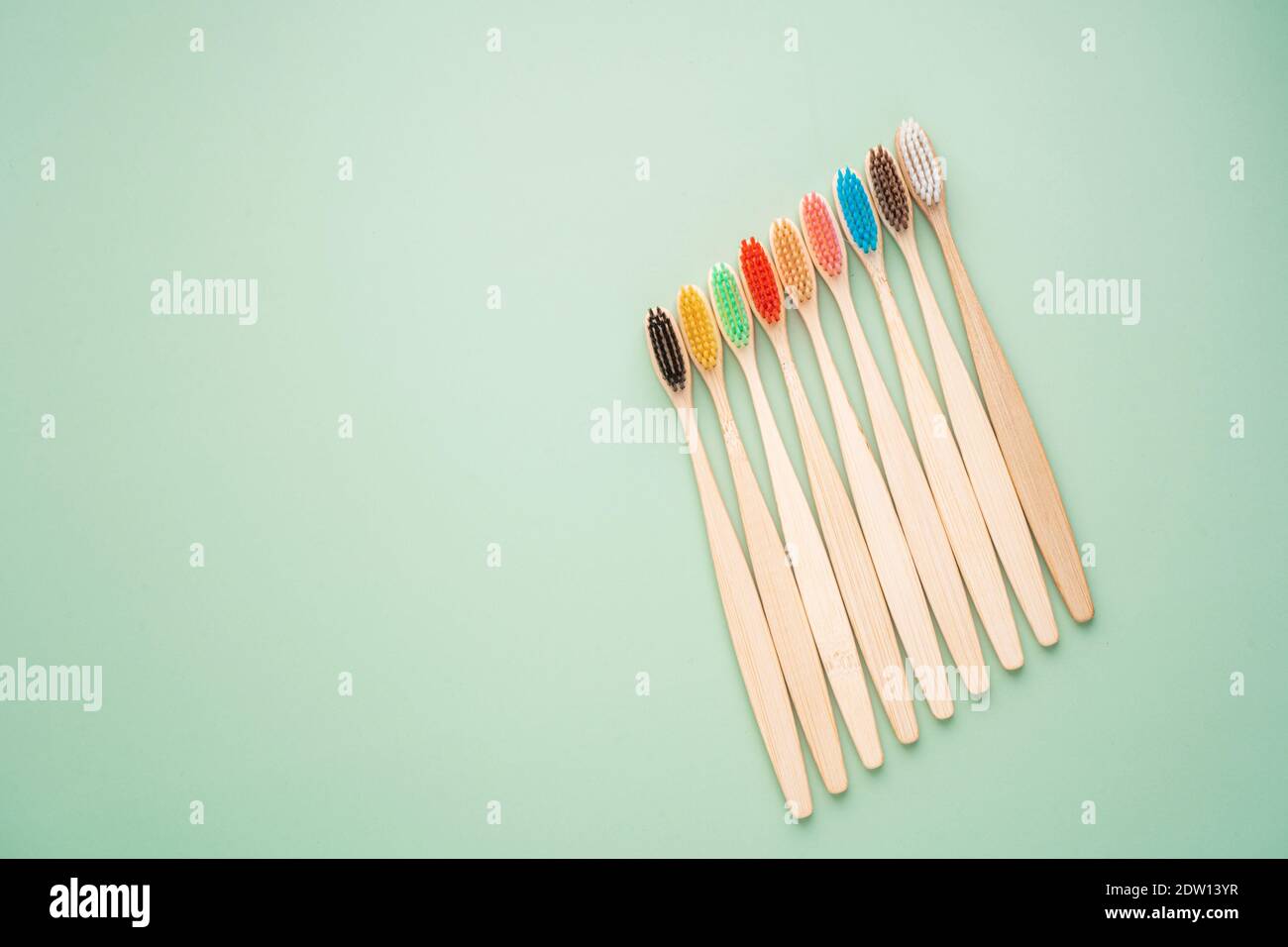 A set of Eco-friendly antibacterial toothbrushes made of bamboo wood on ...