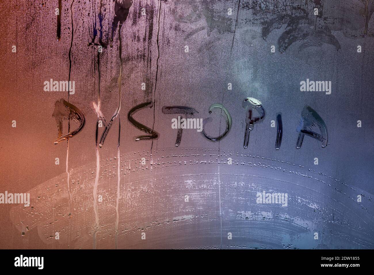 the word dystopia handwritten on wet window glass surface Stock Photo ...