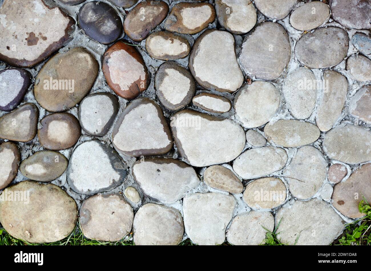 Stone road texture. Cobblestone. Ancient stone floor texture, oval ...