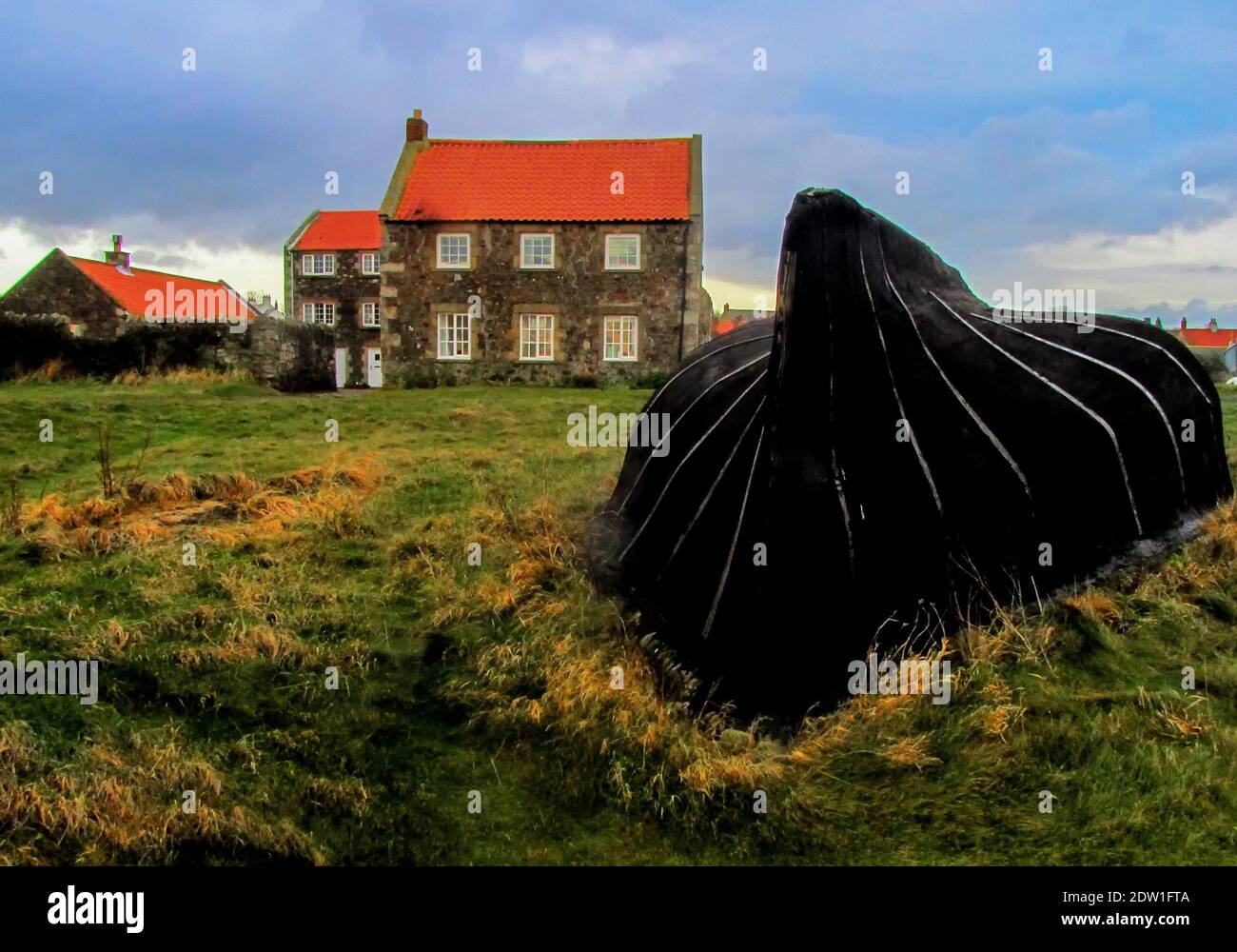 Upturned fishing boat or Currach used for storage on Holy Island Stock ...