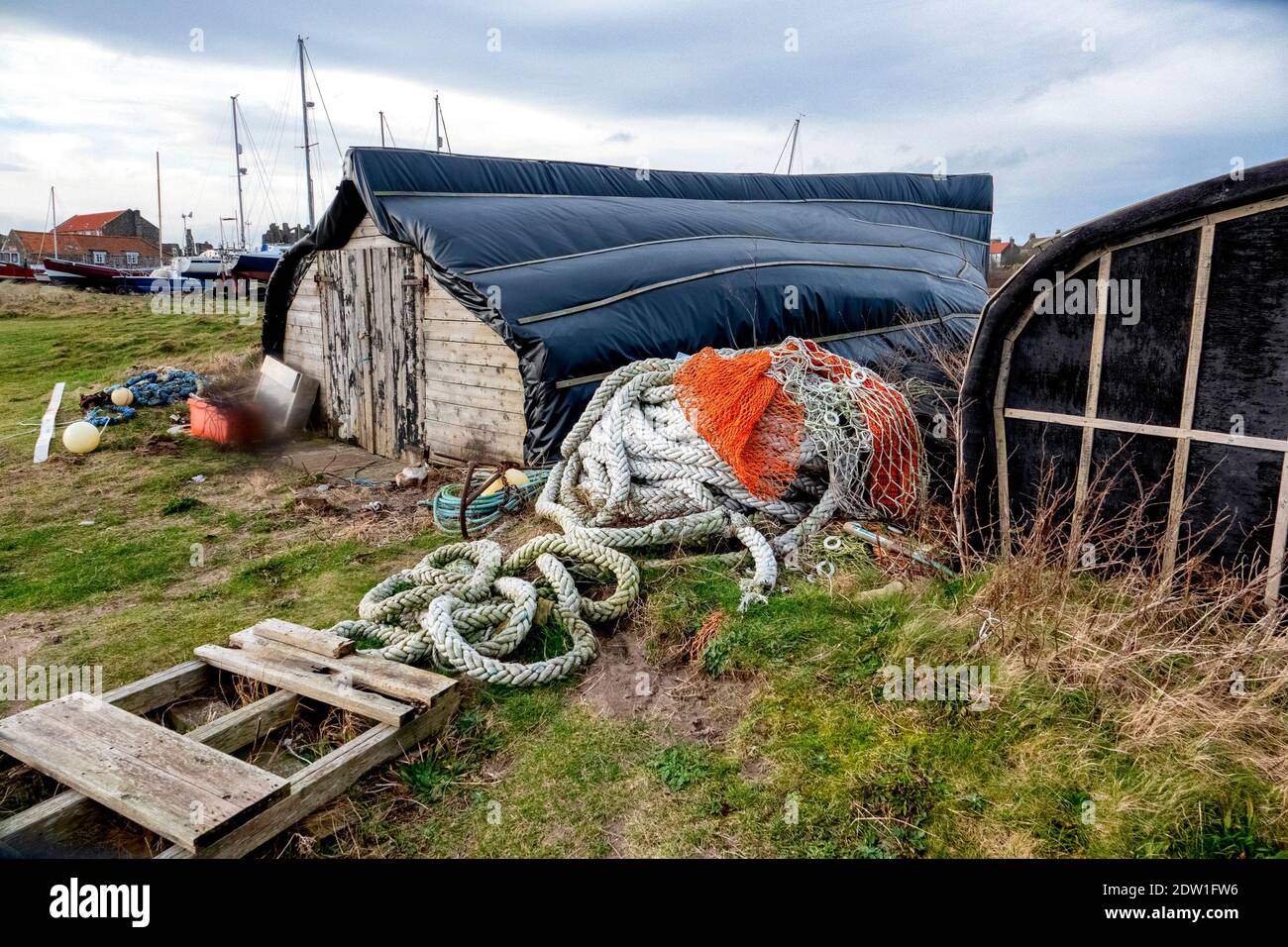 Upturned fishing boat or Currach used for storage on Holy Island Stock ...