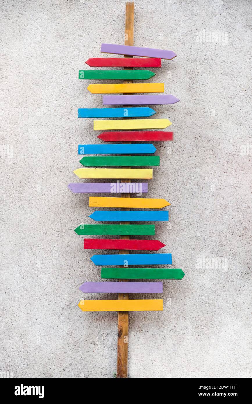 Numerous coloured signs without text against a grey wall Stock Photo ...