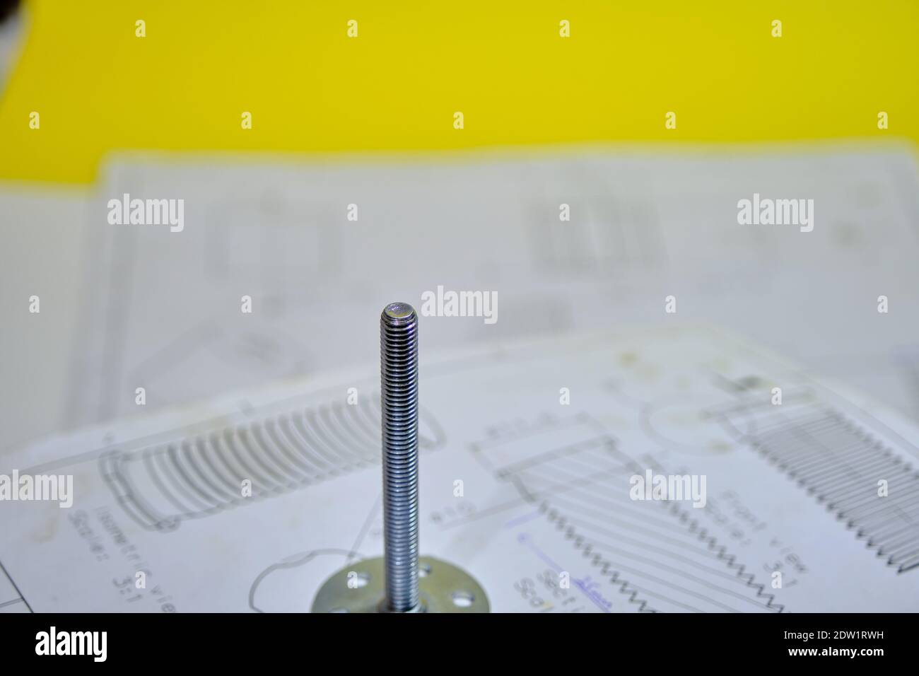 M8 bolt bonding fastener with blurred technical drawing and yellow ...