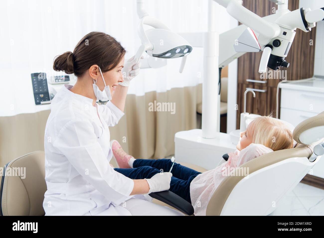 A beautiful little child having a dental check up Stock Photo - Alamy