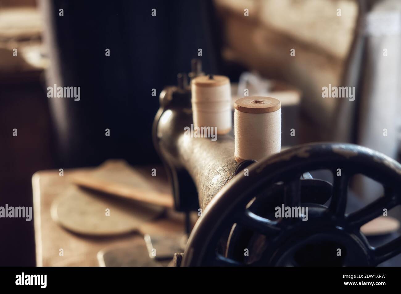 Old retro sewing machine and wooden sewing layouts Stock Photo - Alamy
