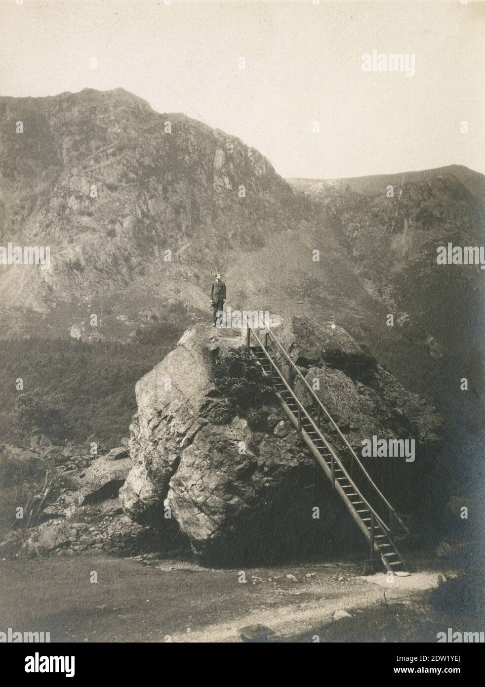 Antique c1900 photograph, tourist atop the Bowder Stone in Borrowdale ...