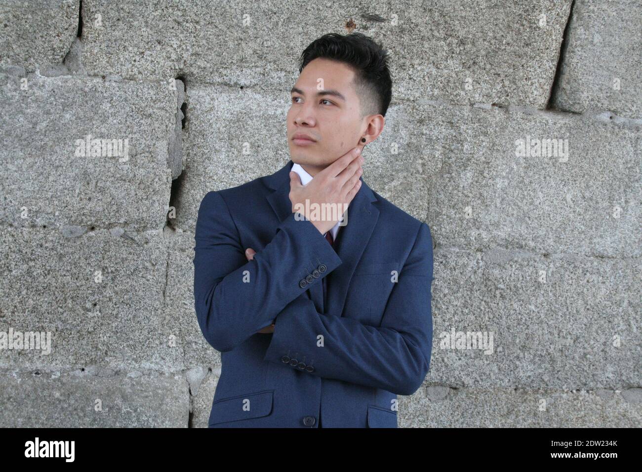 A portrait of a male model in a suit. Professional looking man outside ...