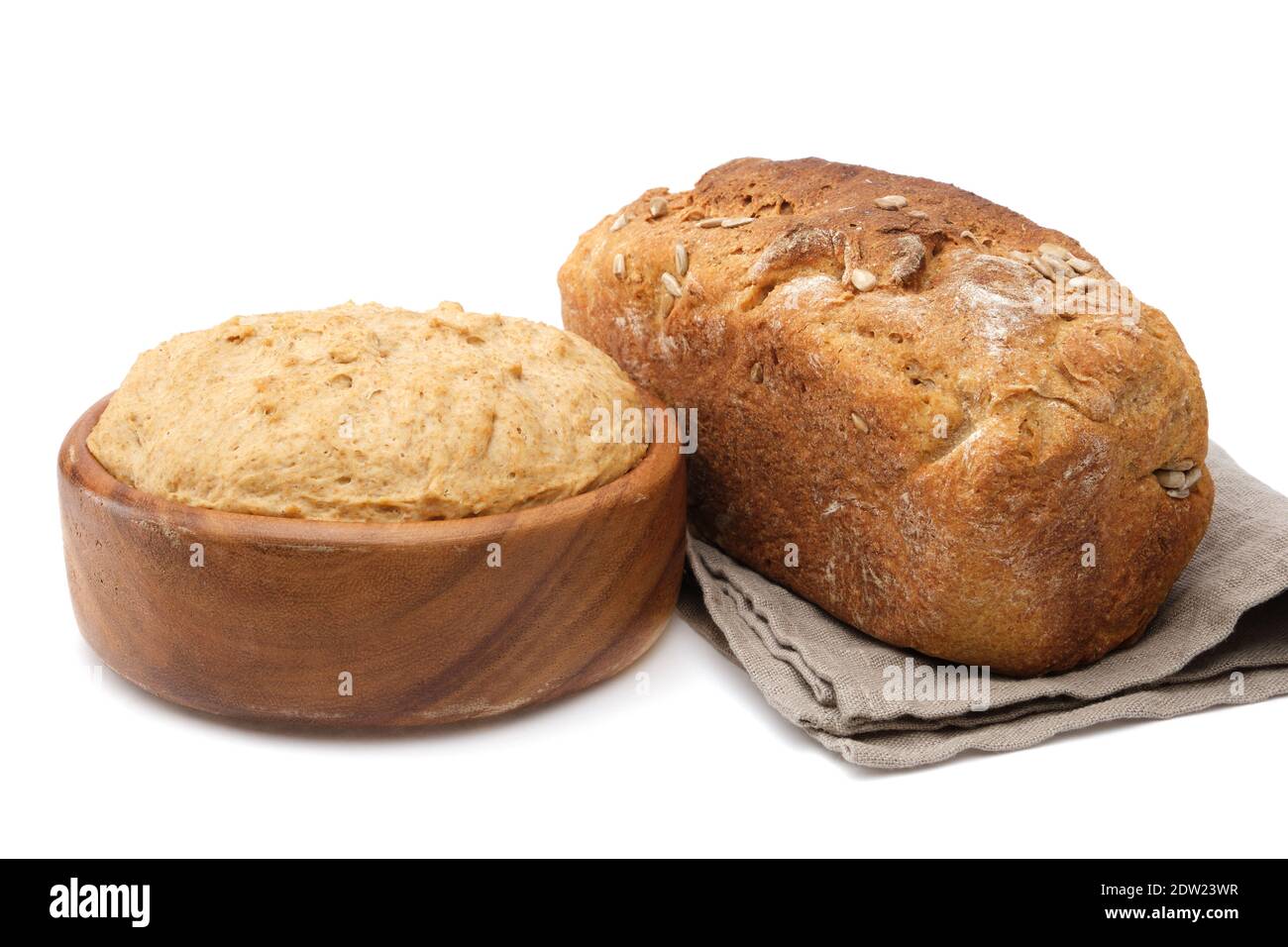 Wooden bowl of dough and freshly baked loaf on white Stock Photo - Alamy